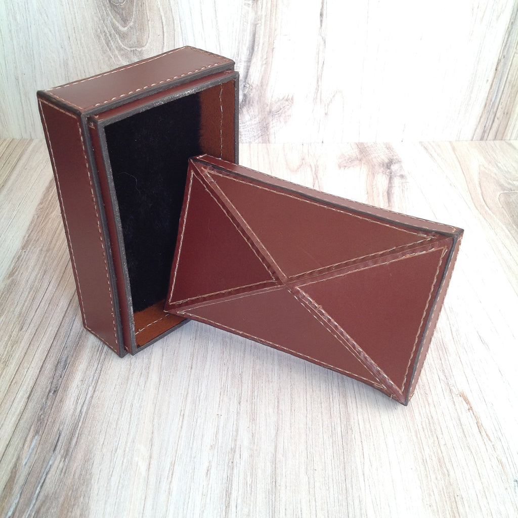 Hand made, hand stitched leather tube with 6 dice and a cool little fly ...